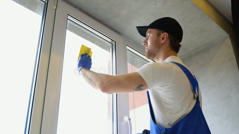 Worker in Uniform Cleaning Window at Home Stock Video - Video of ...