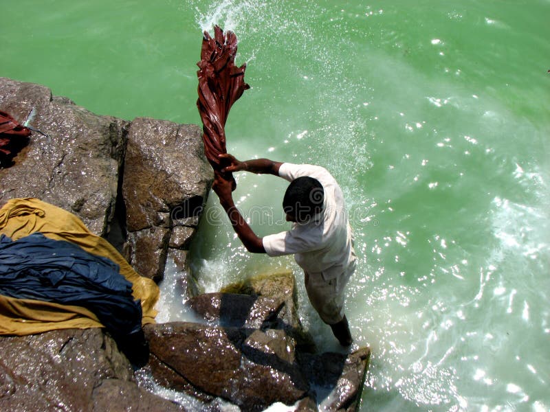 Washing Clothes stock image. Image of drip, males, poor - 2694217