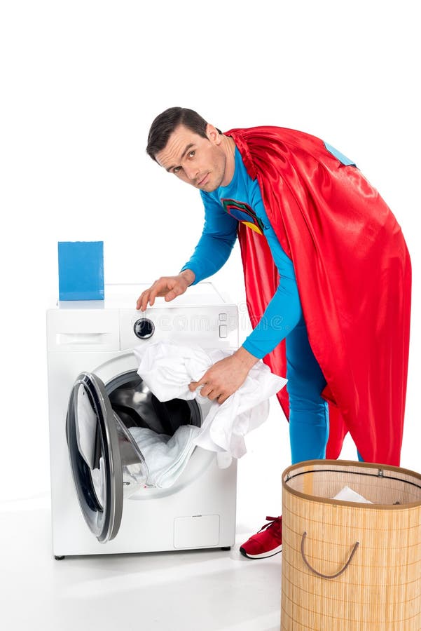 Superman Washing Clothes in Washing Machine and Looking at Camera Stock ...
