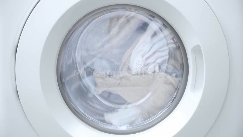 Washing Clothes Process. Washing Machine Working with Laundry, Close Up ...
