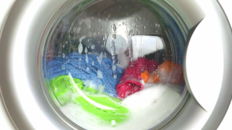Washing Colored Laundry in the Washing Machine Stock Footage - Video of ...