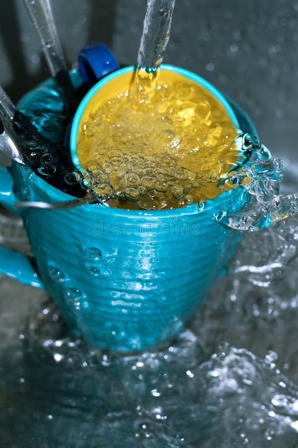 Washing Cutlery and Cups stock photo. Image of athome - 40053124