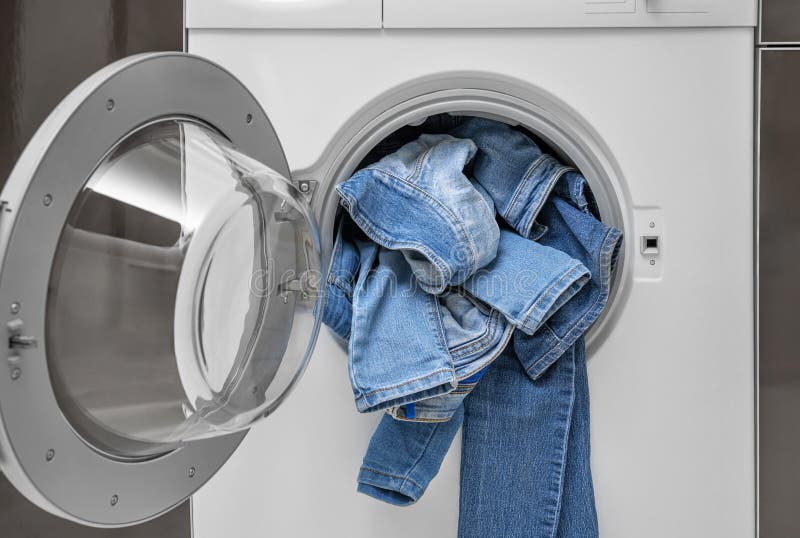 Washing Denim in a Washing Machine. Stock Photo - Image of vertical ...
