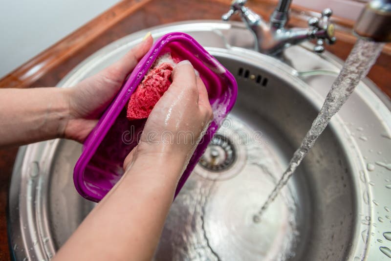Washing the Dishes in the Kitchen Sink Stock Image - Image of housework ...
