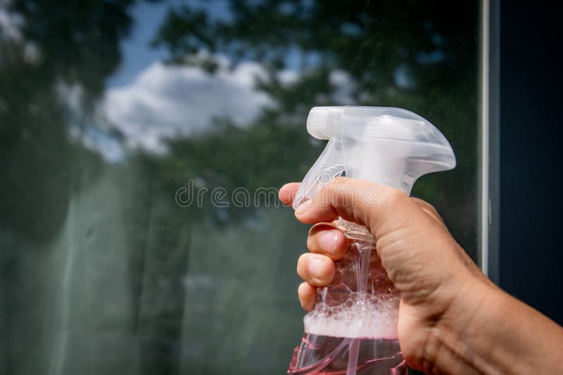 Washing the Glass on the Windows with Spray Stock Image - Image of ...