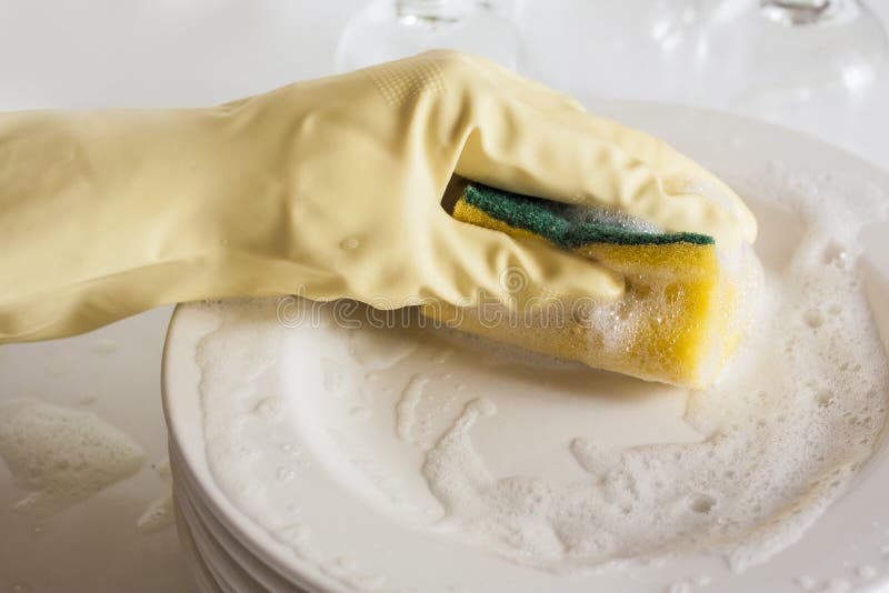 Washing glasses and plates stock image. Image of chores - 28270971