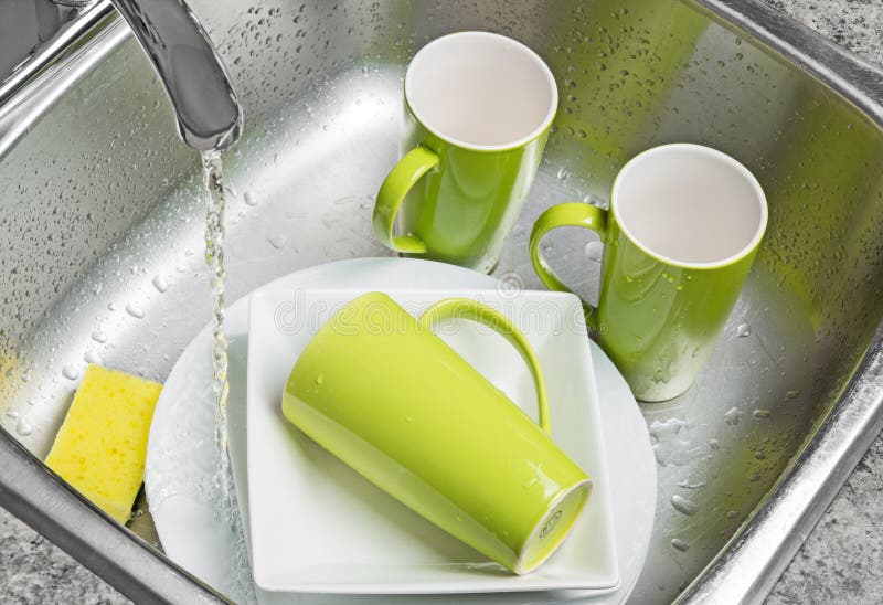 Washing Green Cups and Plates in the Kitchen Sink Stock Image - Image ...