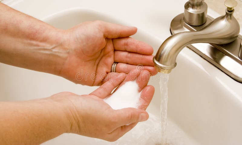 Washing hands stock image. Image of foamy, pouring, medical - 1549969