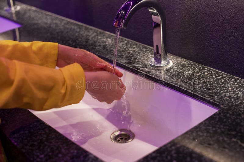 Washing Hands in a Modern Interior with Purple Stock Photo - Image of ...