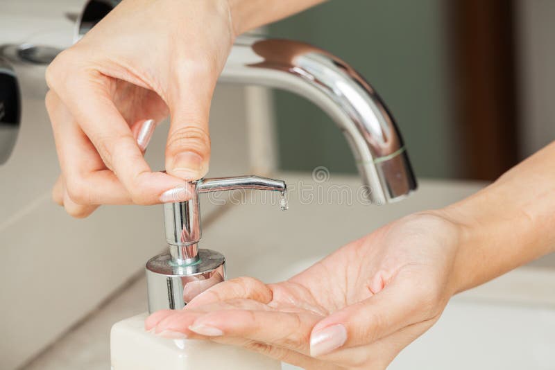 Putting some soap on hands stock image. Image of bathroom - 11368361