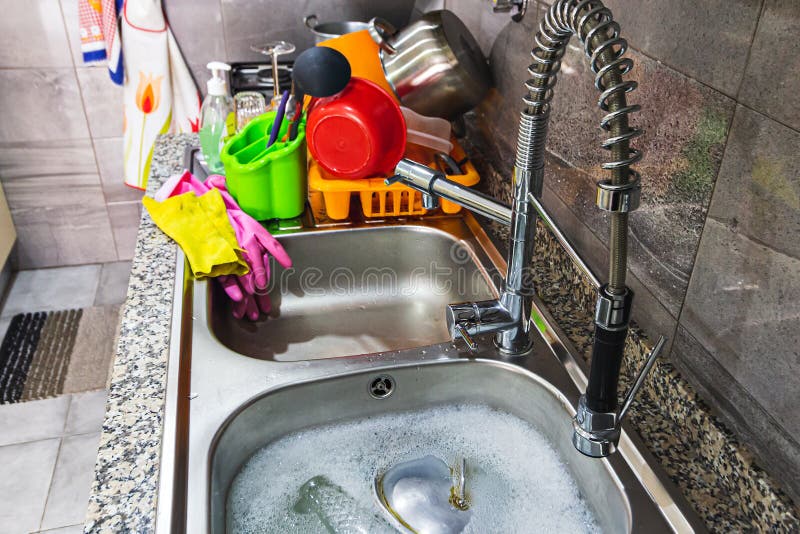 Washing kitchen utensils stock image. Image of surface - 162619277