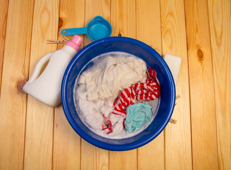 Washing the laundry manual stock photo. Image of bucket - 54545594