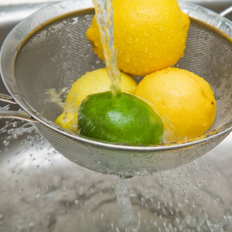 Washing lemons and lime stock photo. Image of citrus - 14890874