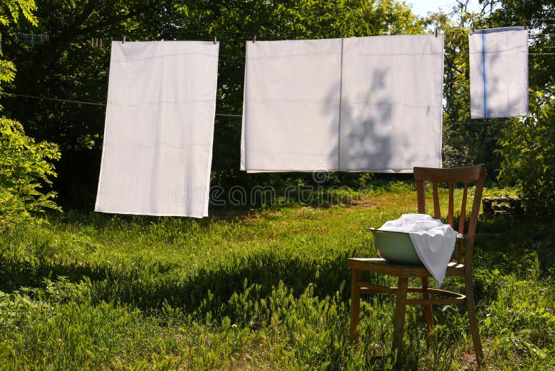 Washing Line with Clean Laundry and Clothespins Outdoors Stock Photo ...