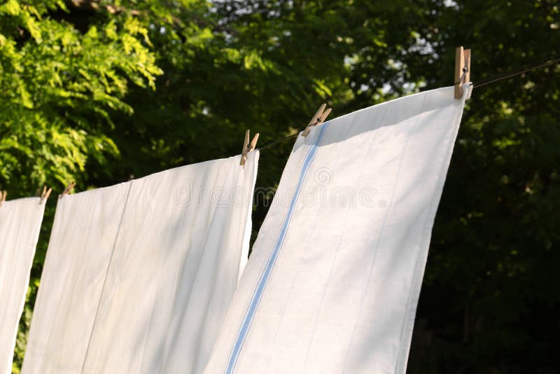Washing Line with Clean Laundry and Clothespins Outdoors Stock Image ...