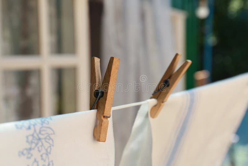Washing Line with Clean Laundry and Clothespins Outdoors, Closeup ...