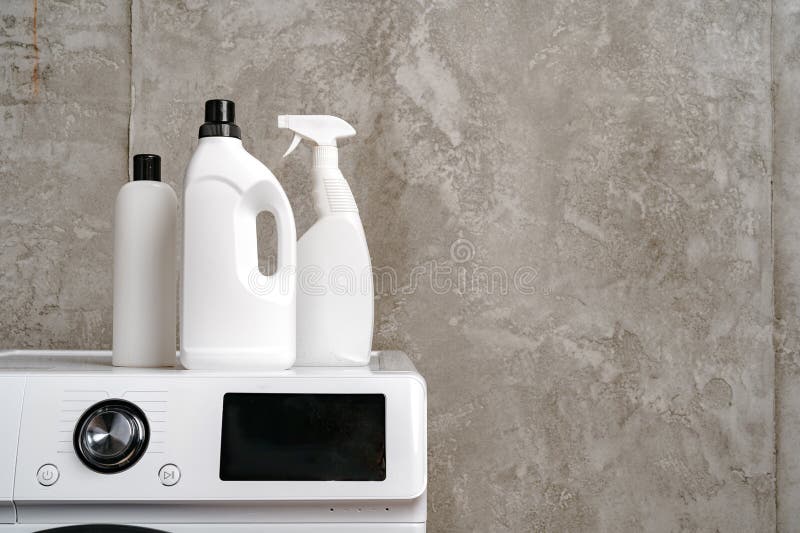 Washing Liquid Detergents on Washing Machine in a Laundry Room Stock ...