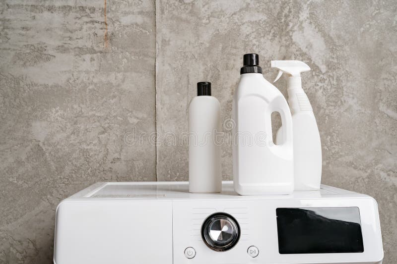 Washing Liquid Detergents on Washing Machine in a Laundry Room Stock ...