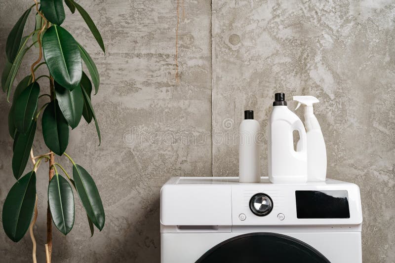 Washing Liquid Detergents on Washing Machine in a Laundry Room Stock ...