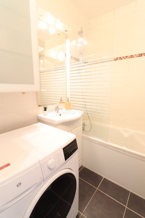 Washing Machine in Bathroom. Nice Bathtub Editorial Stock Photo - Image ...
