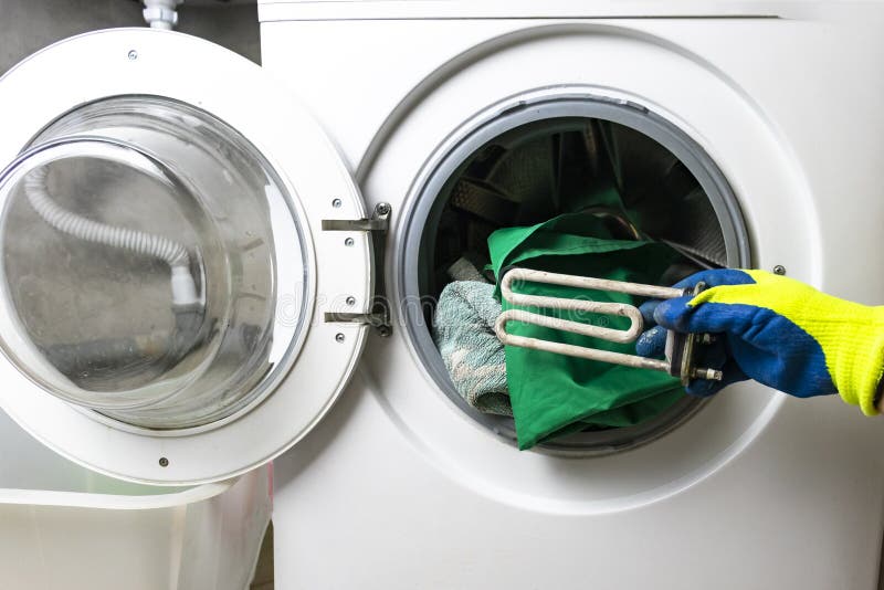 Washing Machine Breakdown. the Master Retrieves the Floor Part. in the ...