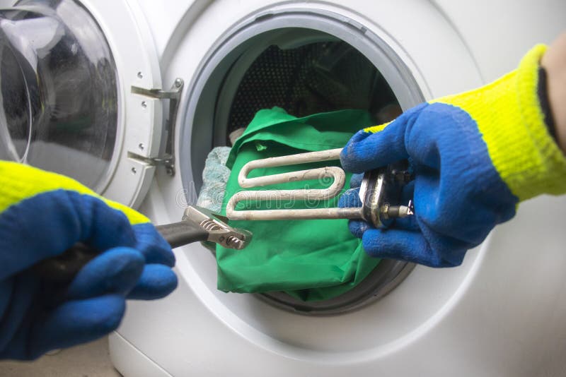 Washing Machine Breakdown. the Master Retrieves the Floor Part. in the ...