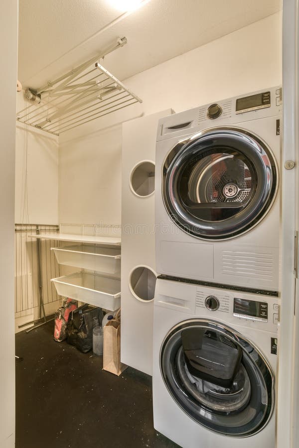 A Washing Machine and Dryer in a Laundry Room Stock Image - Image of ...