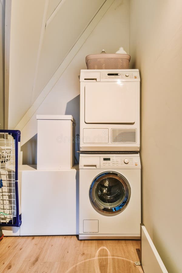 A Washing Machine and Dryer in a Laundry Room Stock Photo - Image of ...