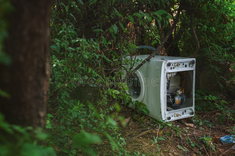 A Washing Machine Dumped in an Illegal Dump. Stock Image - Image of ...