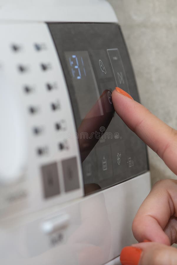 Washing Machine. the Hand Turns on the Washing Machine or the Choice of ...
