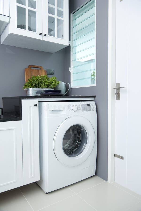 Washing machine in kitchen stock photo. Image of housework - 105089824