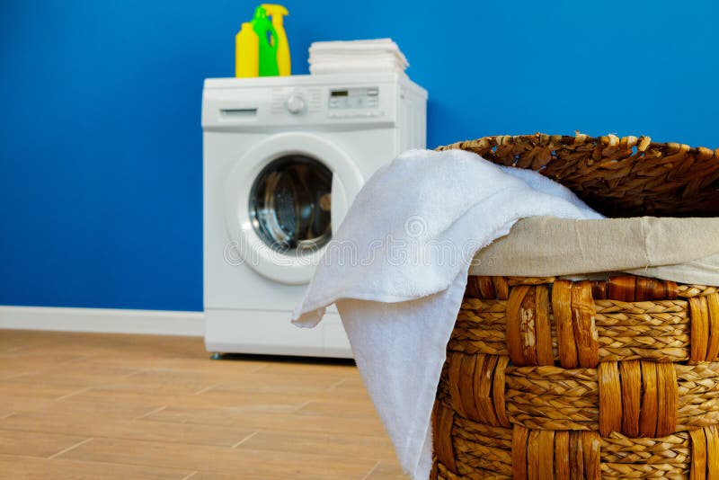 Washing Machine with Laundry on Blue Wall Background Stock Image ...