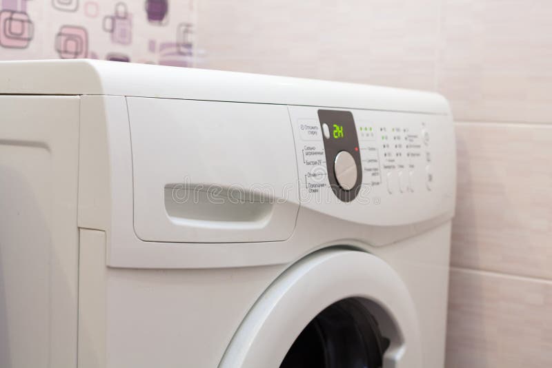 Washing Machine Loaded with Clothes Close-up. Stock Image - Image of ...