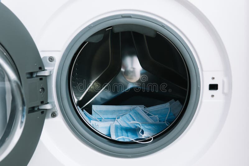 Medical Masks in Washing Machine. Washing Machine Loading Stock Image ...