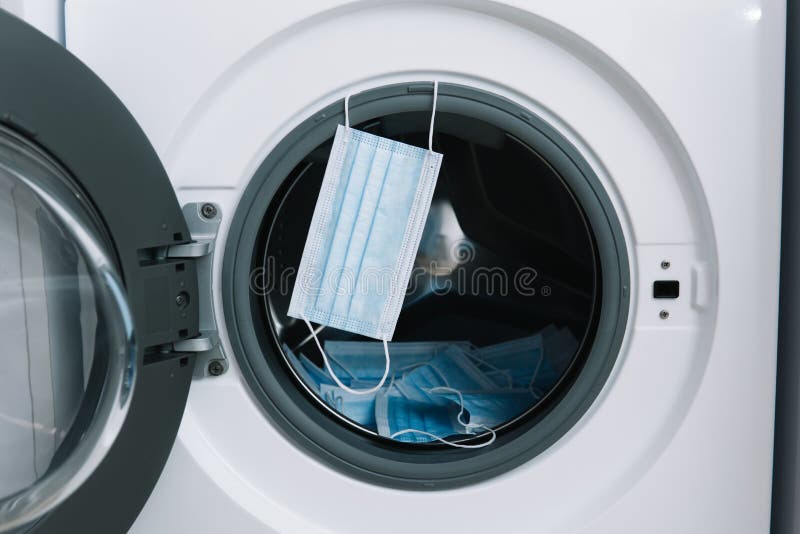 Medical Masks in Washing Machine. Washing Machine Loading Stock Image ...