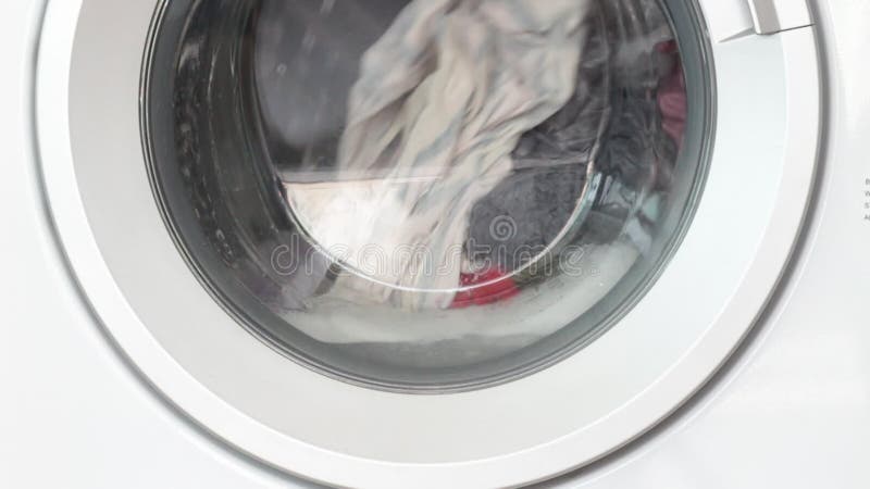 Washing Machine Working with Rotating Garments Inside, Process of ...