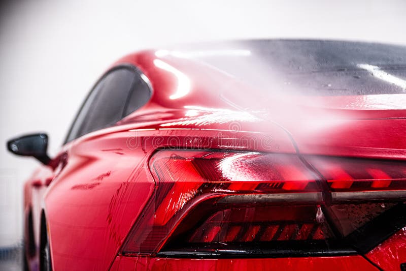 Washing a Modern Red Car at a Car Wash Using a Pressure Washer Stock ...