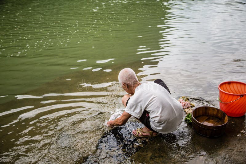 Man Washing Clothes River Stock Images - Download 202 Royalty Free Photos