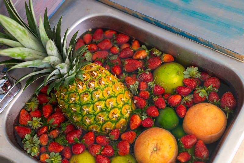 Washing Pineapple, Strawberries and Oranges Stock Image - Image of home ...