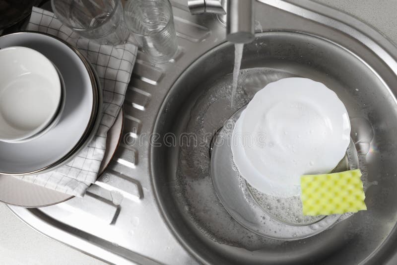 Washing Plates in Kitchen Sink, Above View Stock Photo - Image of ...