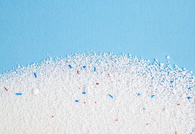 Washing Powder with Blue and Red Granules on a Blue Background. Stock ...