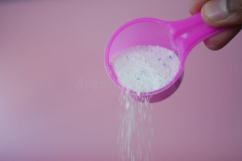 Washing Powder Falling from a Plastic Spoon Stock Photo - Image of ...