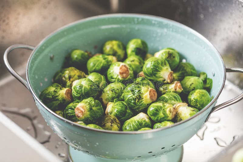 Washing Raw Brussels Sprouts in Kitchen Sink Stock Photo - Image of ...