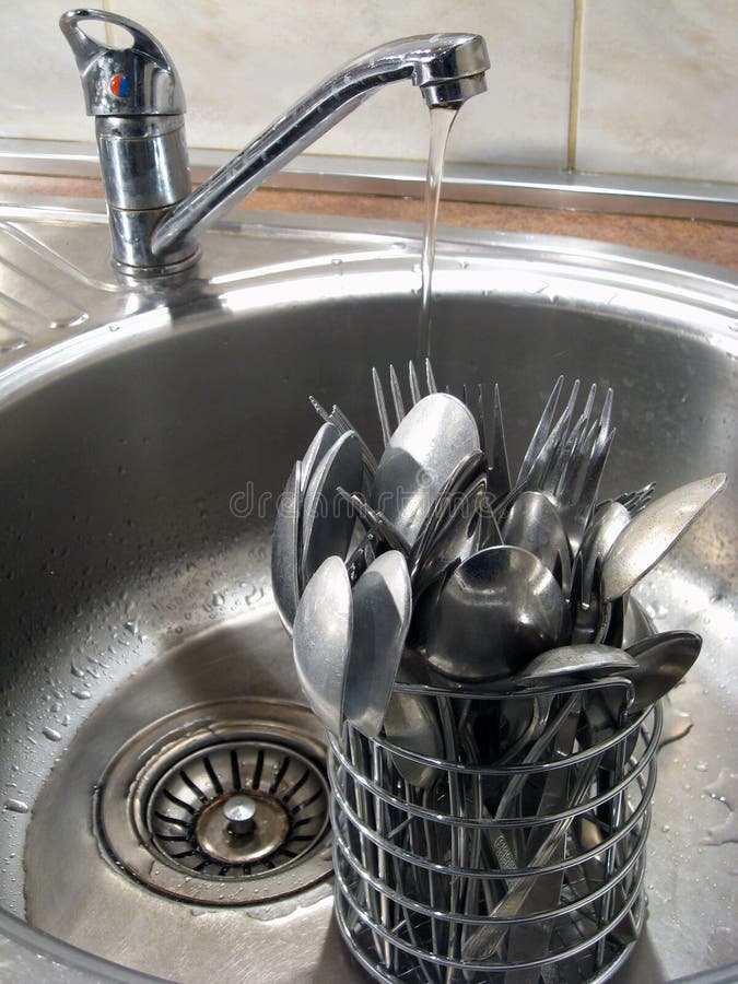 Washing spoons stock photo. Image of crane, stainless - 53298566