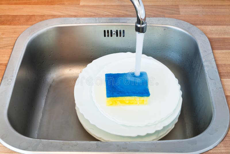 Washing-up by dish sponge stock photo. Image of cooker - 34768838