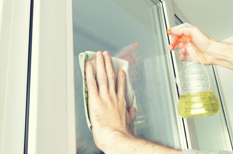 Washing Windows with a Special Liquid Stock Photo - Image of plastic ...