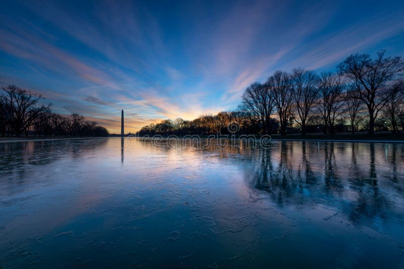 Washington Monument is Reflected in the Frozen Mirror Pond in ...