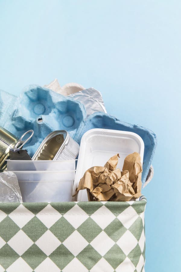 Sorting Garbage for Processing at Home - Basket on a Blue Background ...