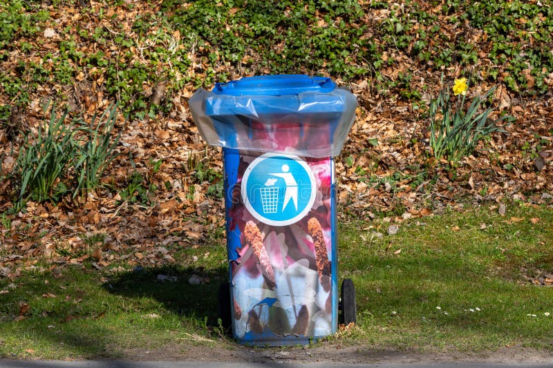 Waste Bin with Signs on a Lawn in a Park Stock Image - Image of sign ...