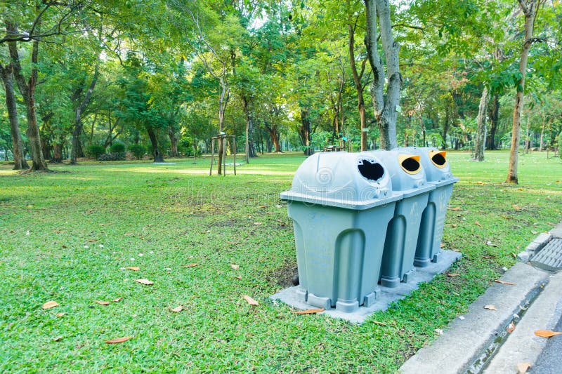 Waste Bins in Park Surrounded by Lush Greenery and Trees, Promoting ...